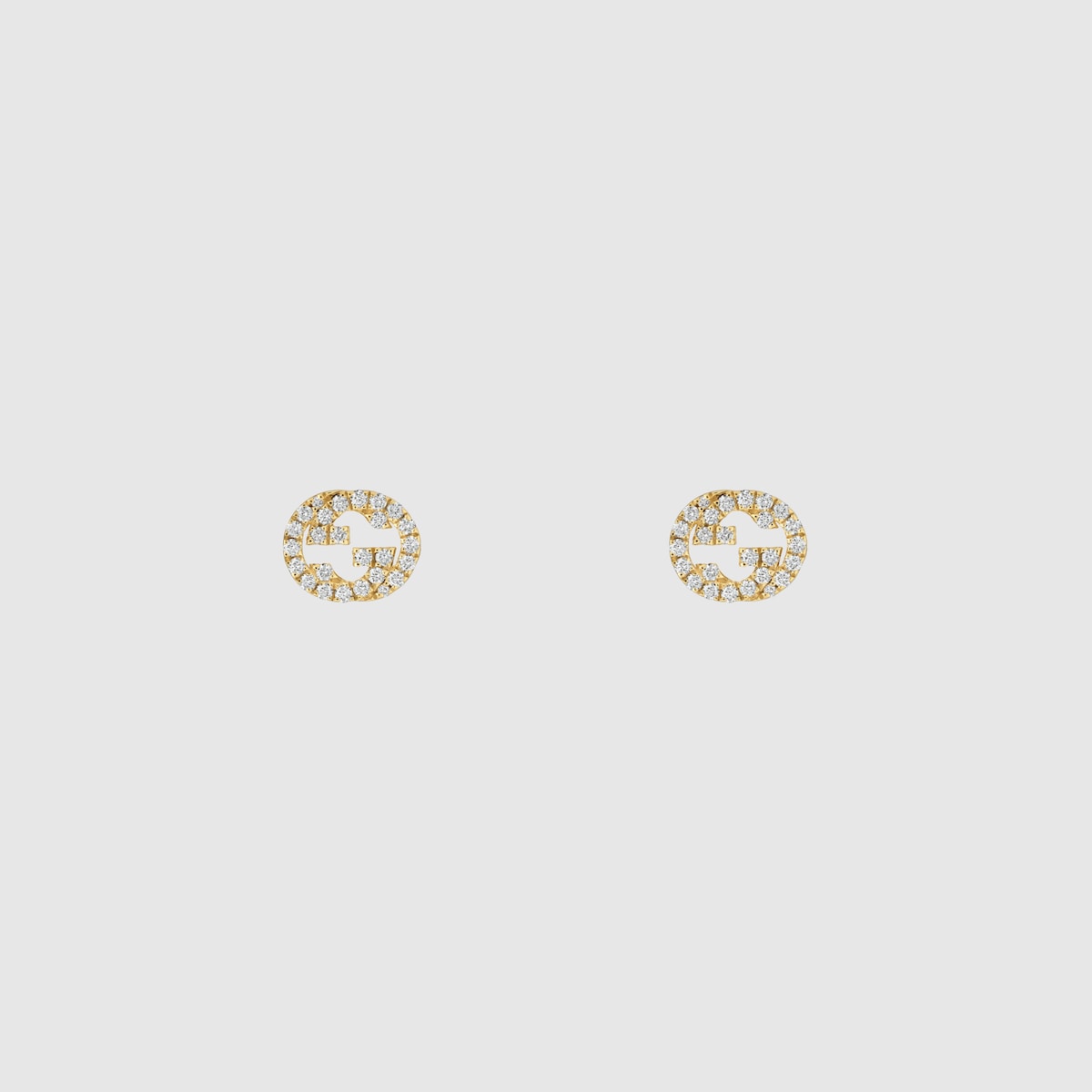 Gucci Interlocking studs with diamonds in 18k yellow gold | GUCCI® UK