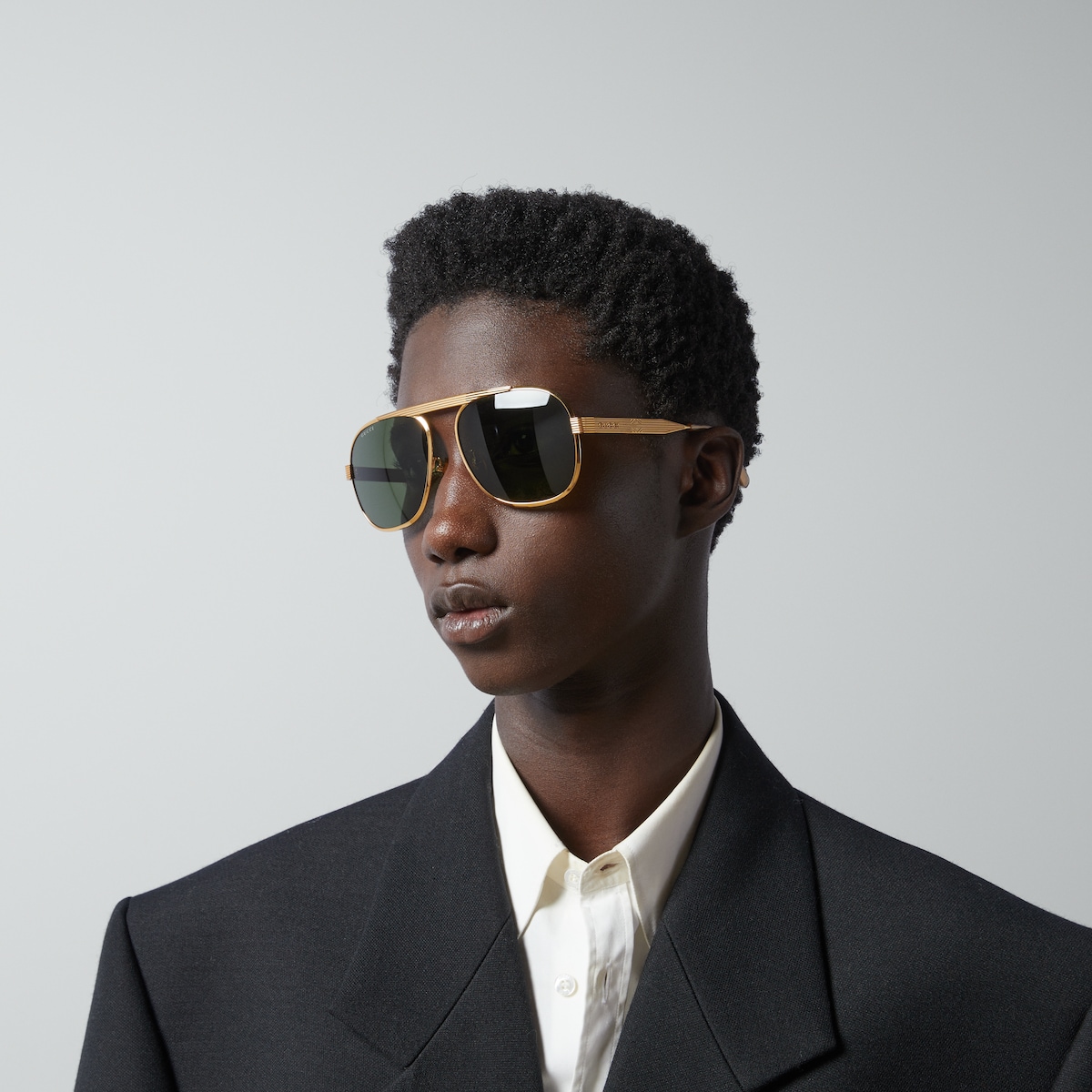Navigator frame sunglasses in gold-toned metal | GUCCI® SG