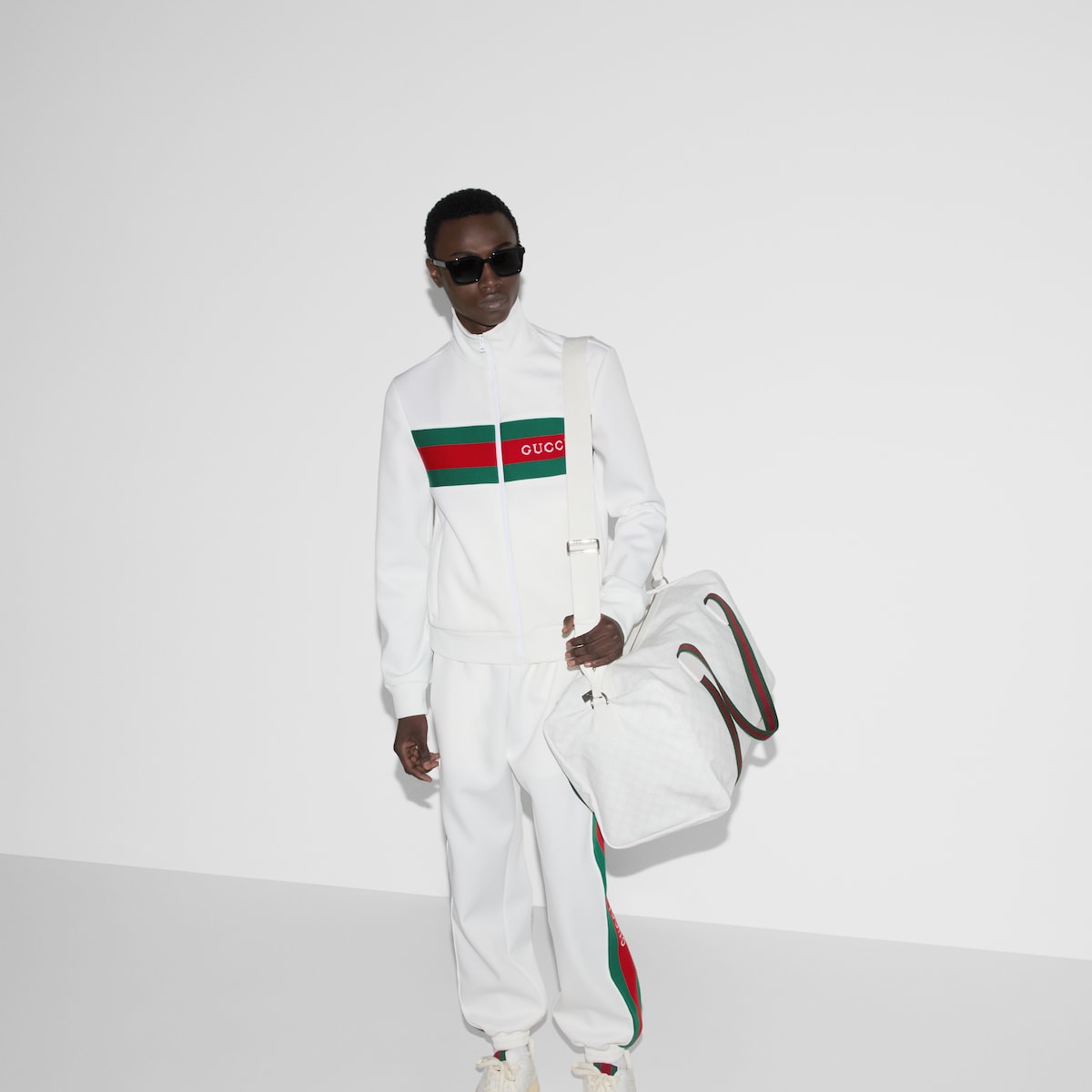 Medium duffle bag with Web in white GG Supreme | GUCCI® AU