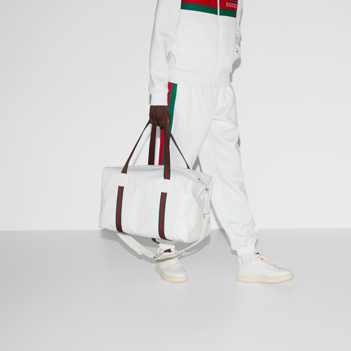 Medium duffle bag with Web in white GG Supreme | GUCCI® AU
