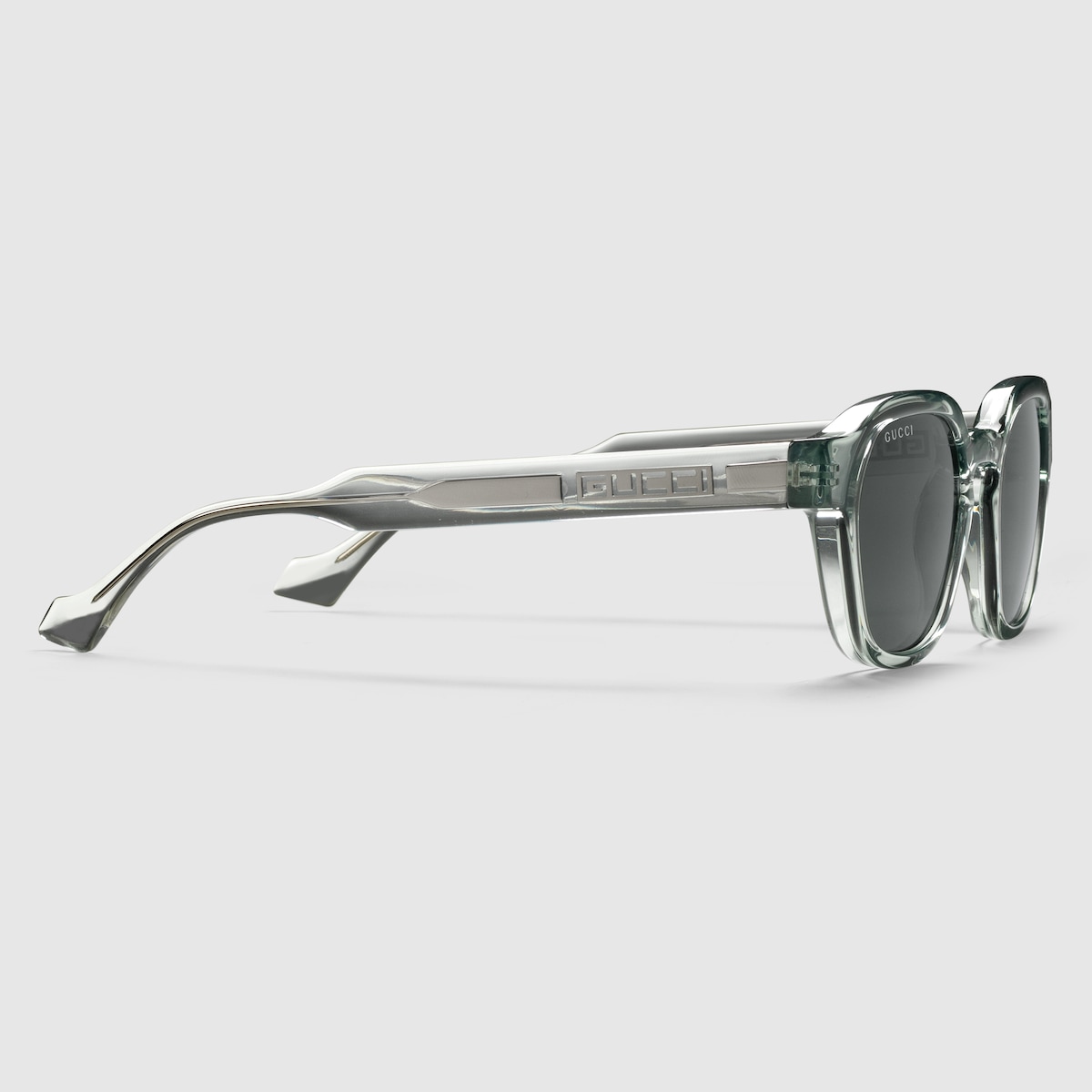 Oval frame sunglasses in transparent grey | GUCCI® US