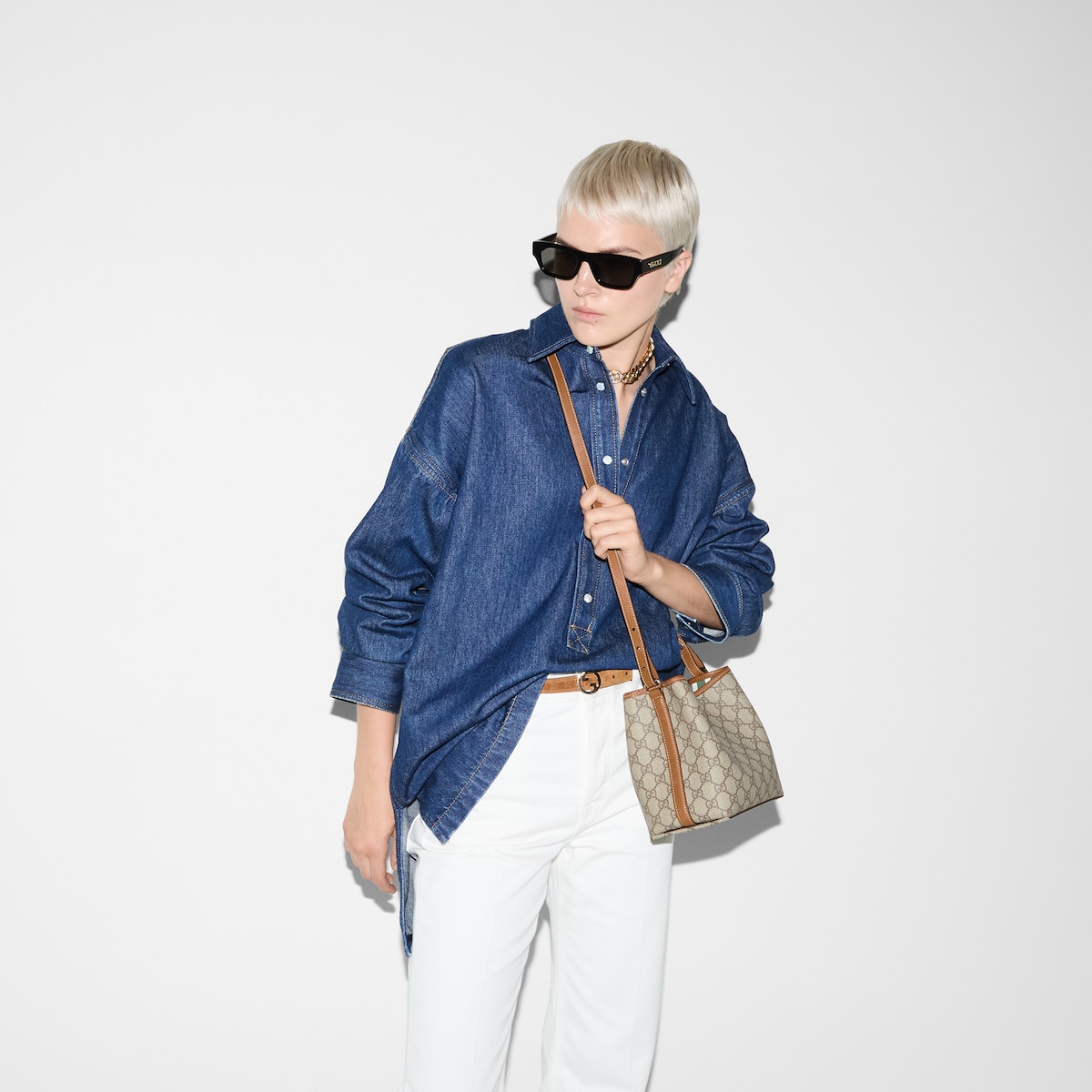 GG Emblem small bucket bag in beige and dark brown fabric | GUCCI® US