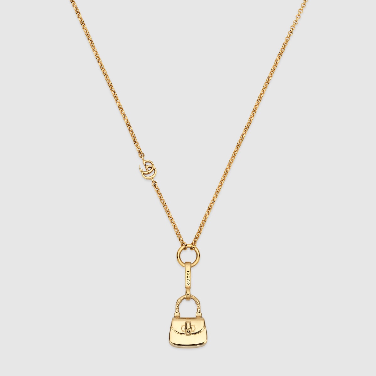 Chain necklace with bag pendant in yellow gold-toned metal | GUCCI® US