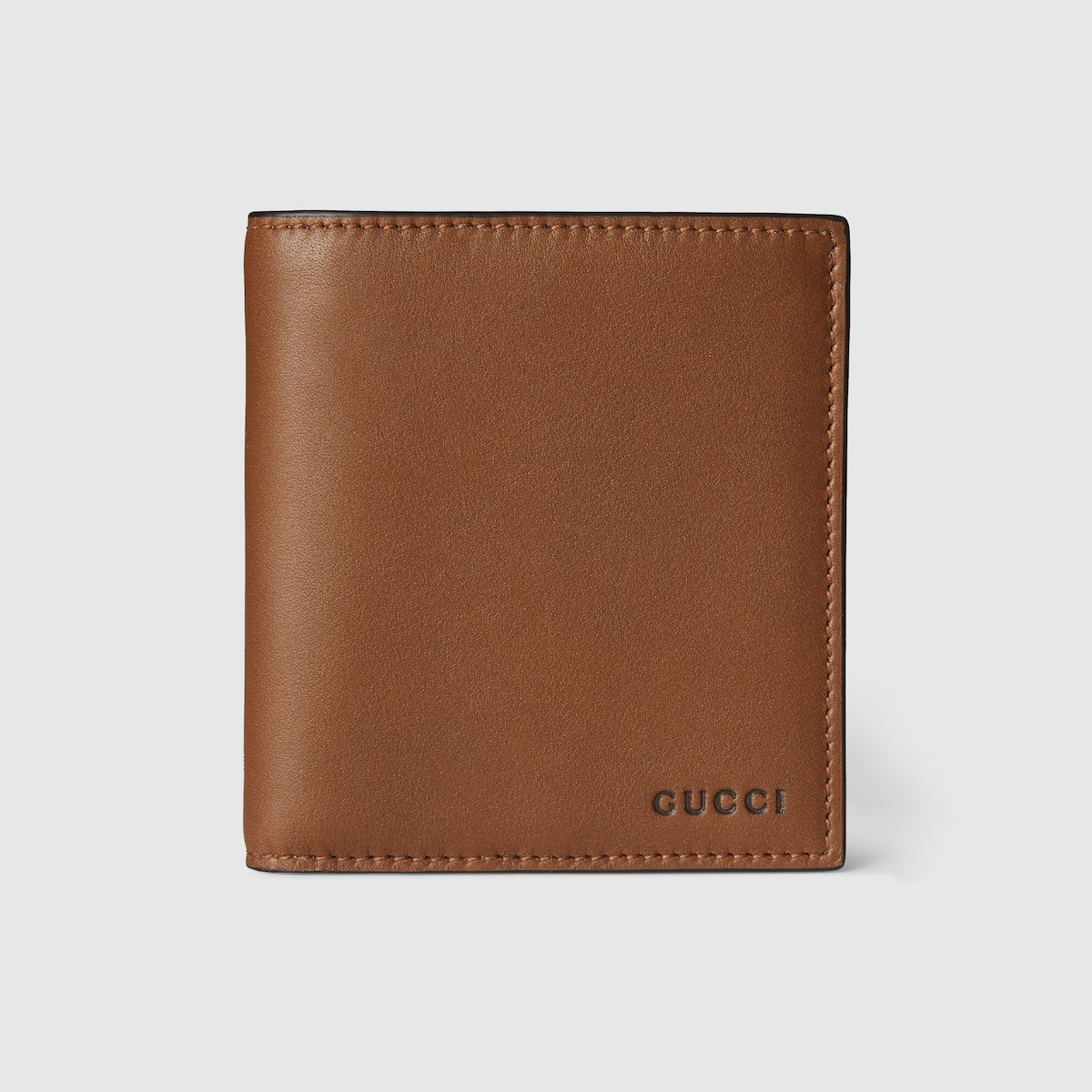 GG Emblem bi-fold embossed wallet in brown leather | GUCCI® Australia