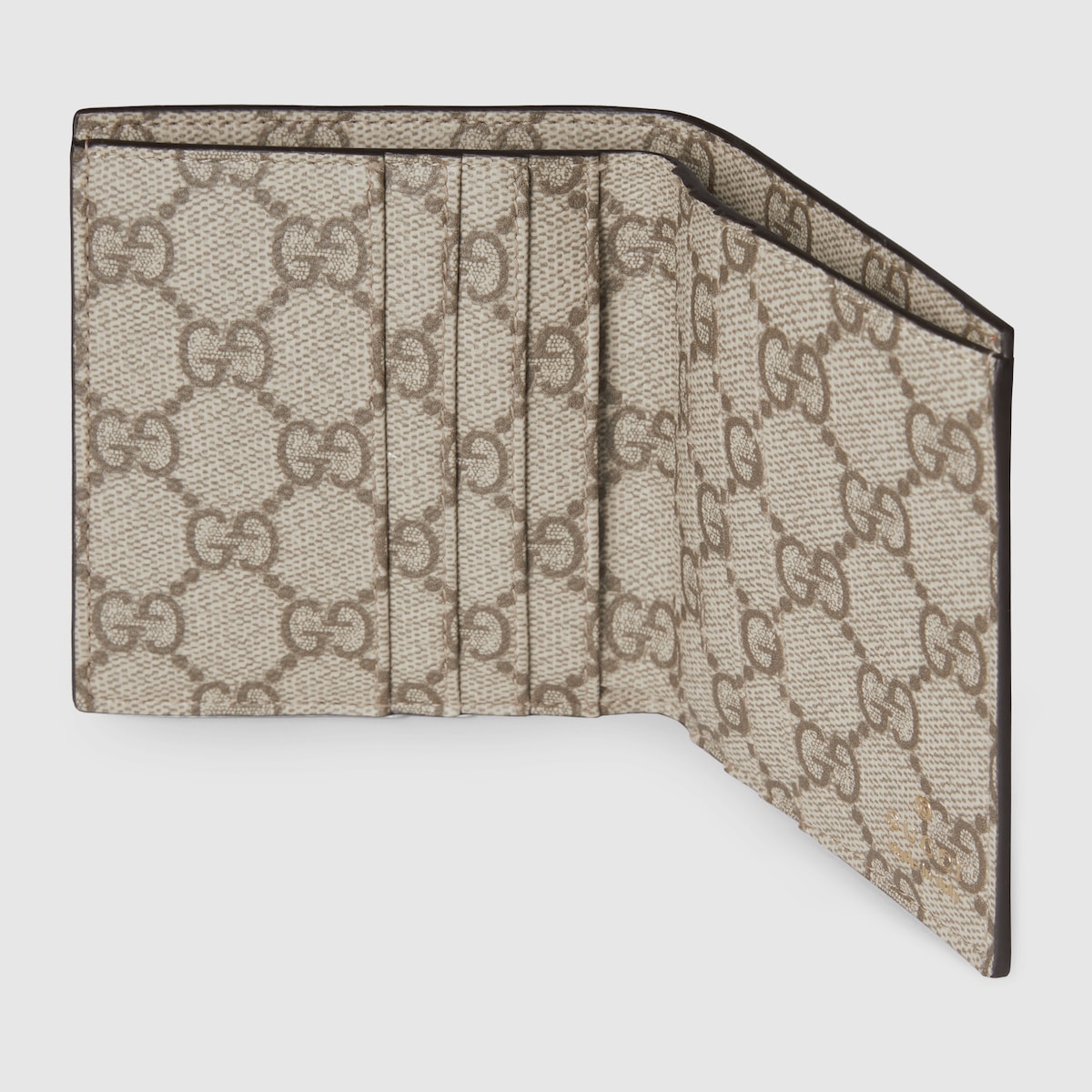 GG Emblem bi-fold embossed wallet in brown leather | GUCCI® NZ