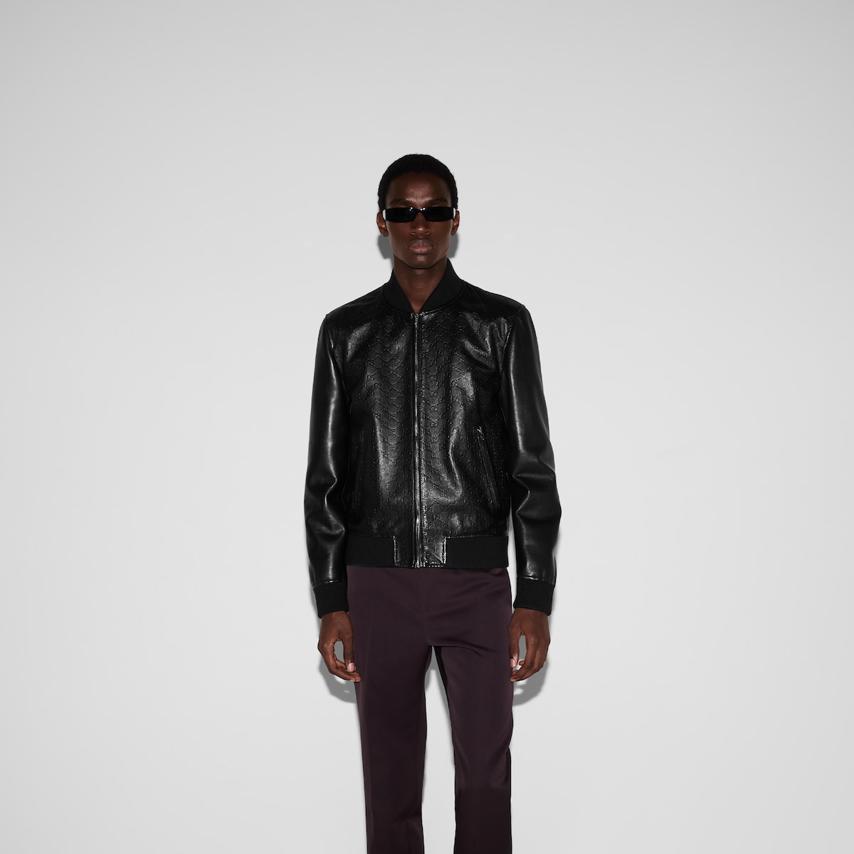Embossed GG leather bomber jacket in black | GUCCI® SG