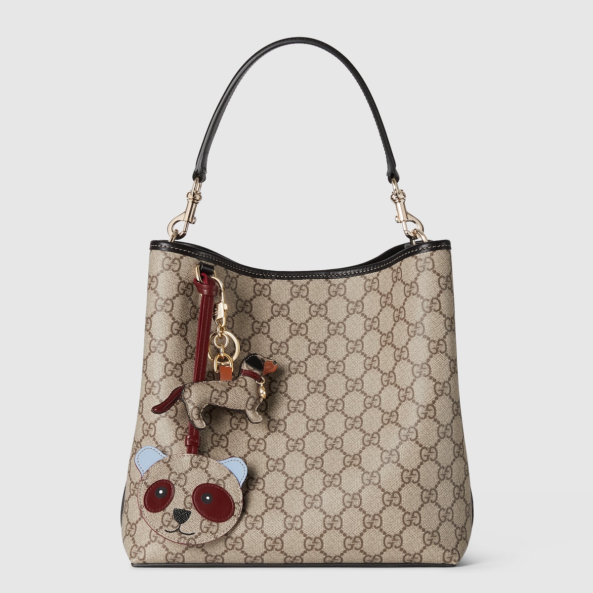 GG Emblem medium bucket bag in beige and dark brown fabric | GUCCI® US