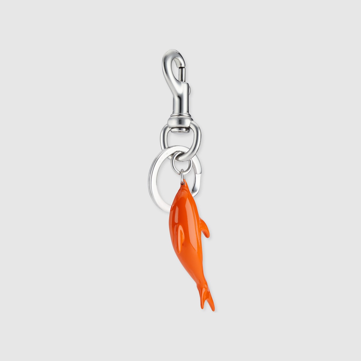 Engraved dolphin keychain charm in bright orange metal | GUCCI® CA