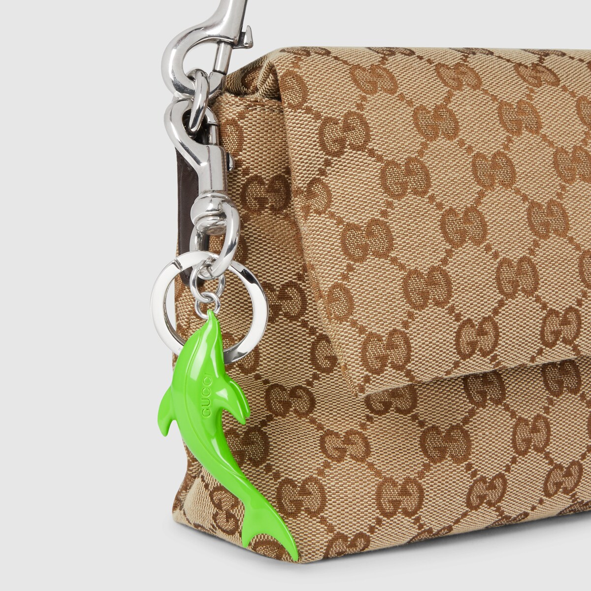 Engraved dolphin keychain charm in bright green metal | GUCCI® US