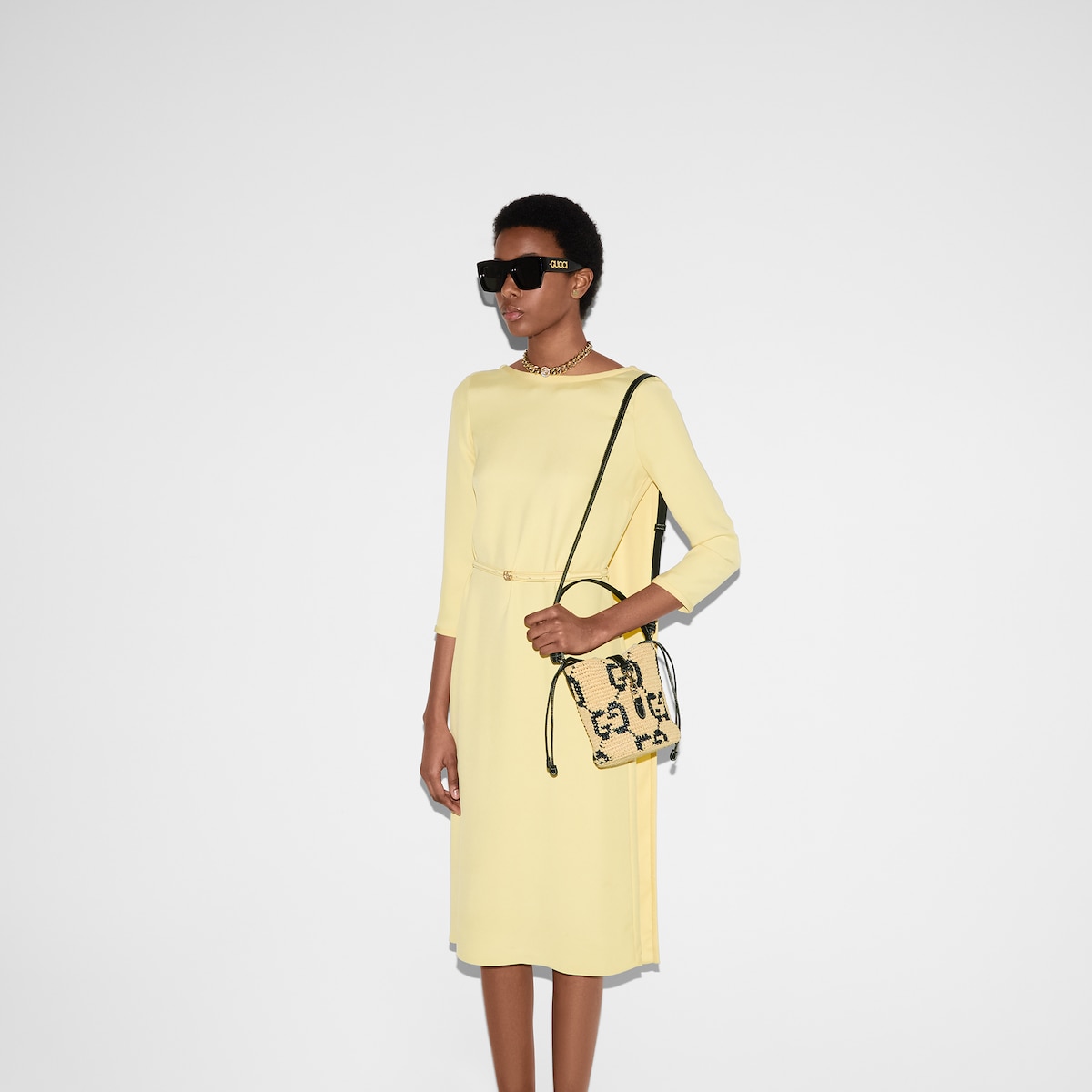 Raffia-effect mini bucket bag in natural and black fabric | GUCCI ...