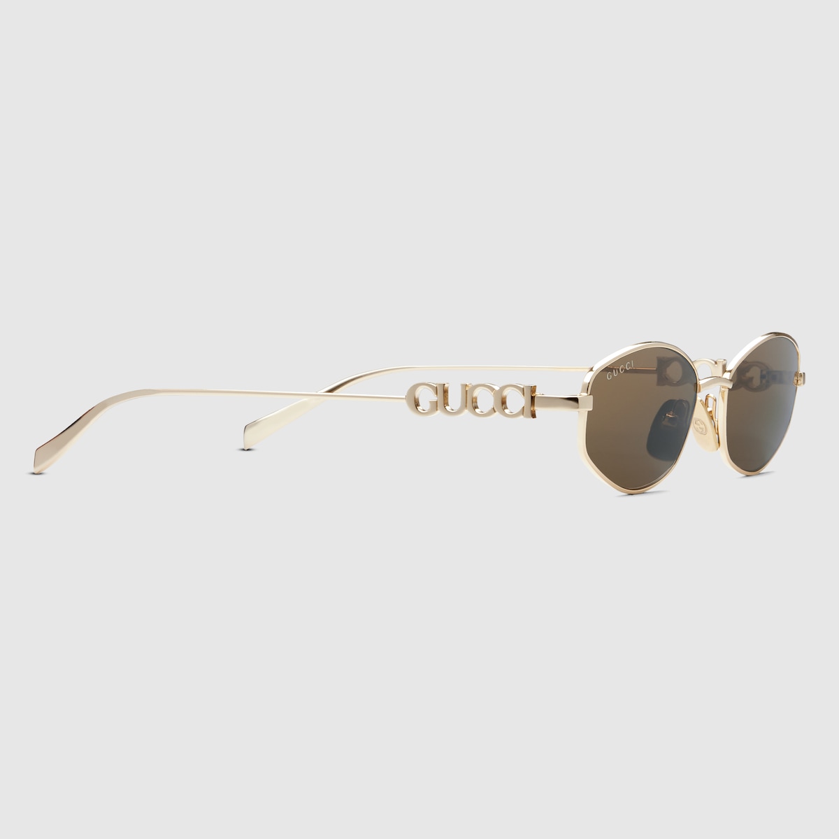 Oval frame sunglasses in gold-toned | GUCCI® US