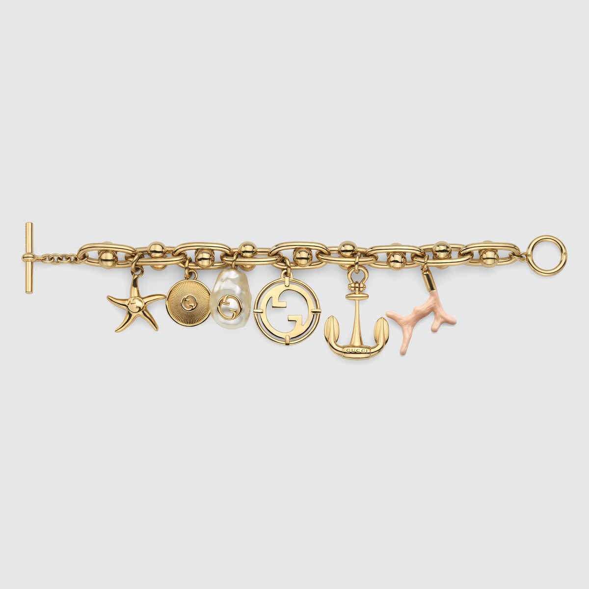 Chain bracelet with Gucci symbols in yellow gold-toned brass | GUCCI® US
