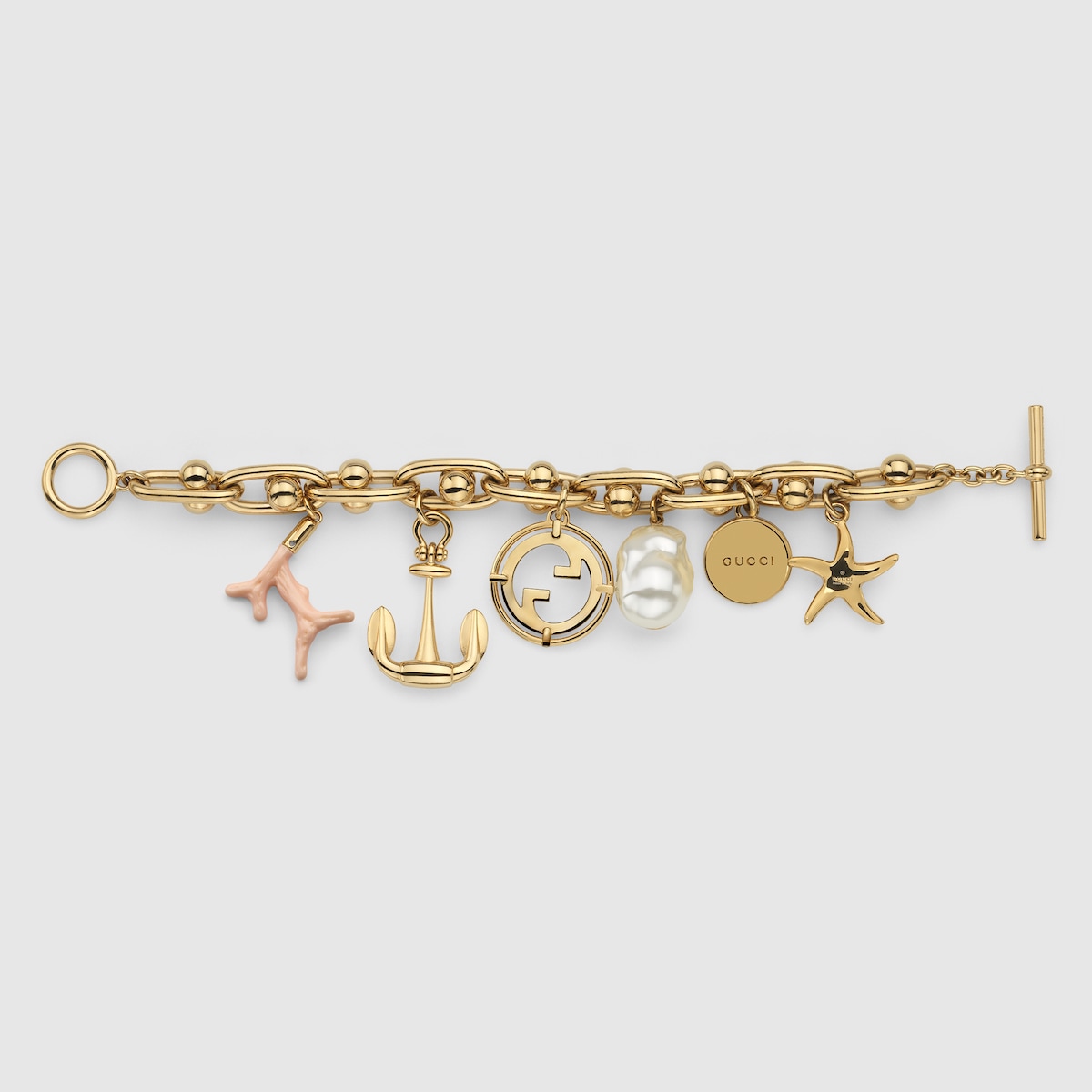 Chain bracelet with Gucci symbols in yellow gold-toned brass | GUCCI® US