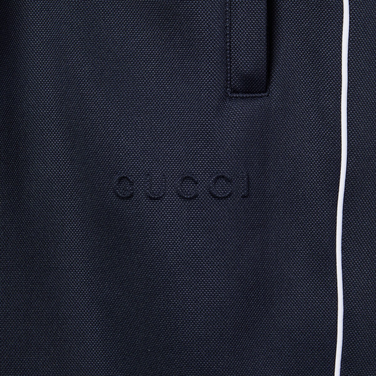 Technical jersey pant with embossed logo in navy | GUCCI® US