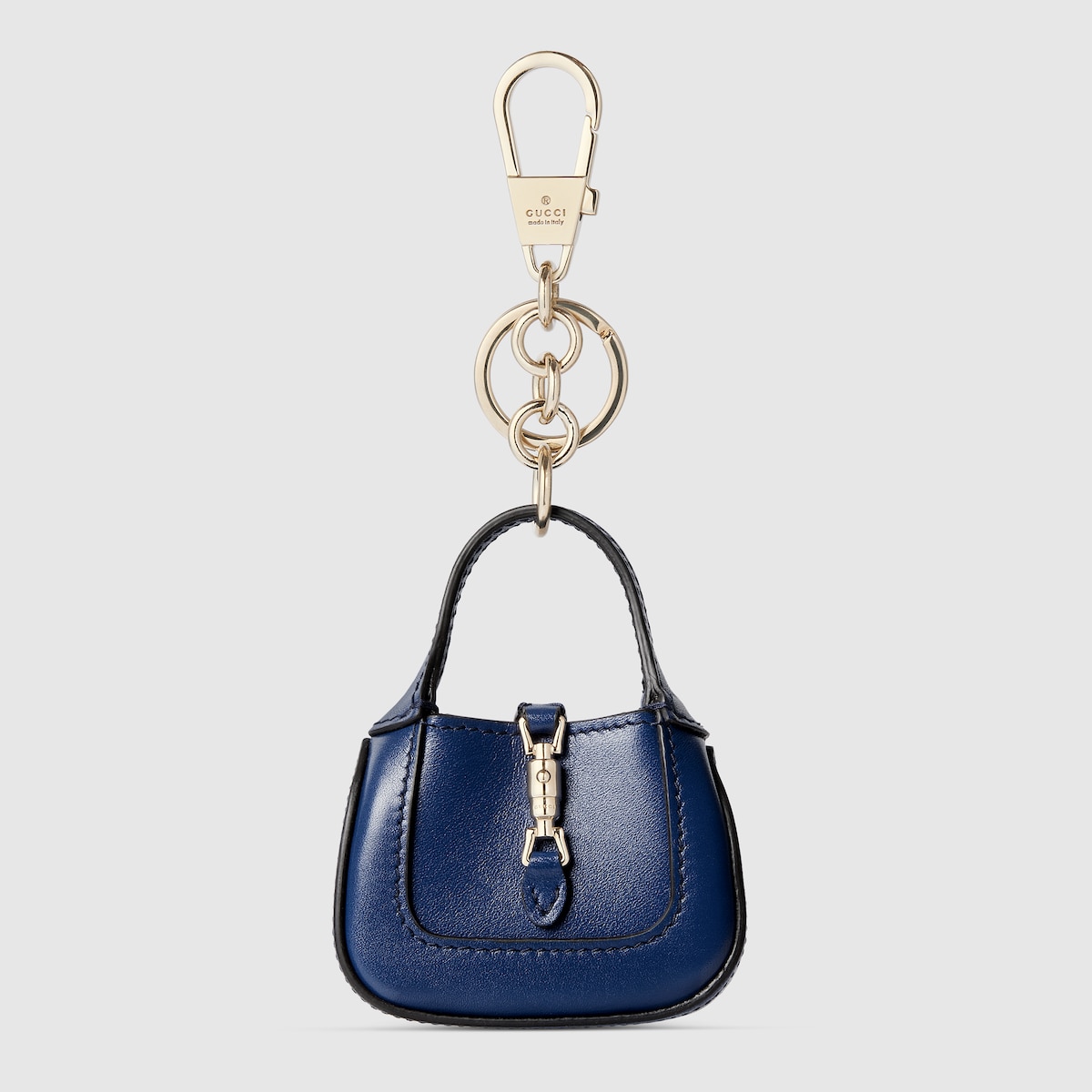 Keychain with Gucci Jackie 1961 in light gold-toned metal | GUCCI® AE