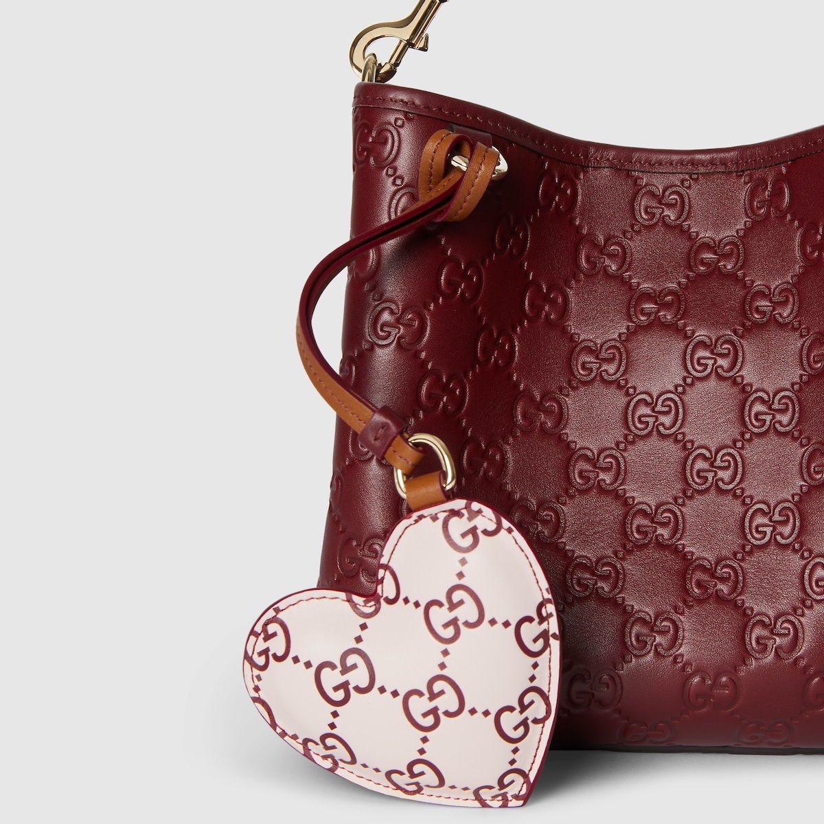 Heart-shaped bag charm in pink embossed GG leather | GUCCI® AU