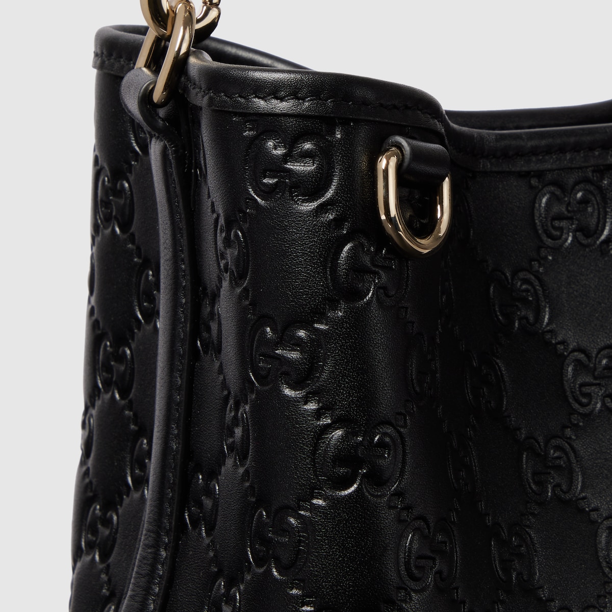 GG Emblem small bucket bag in black GG leather | GUCCI® US