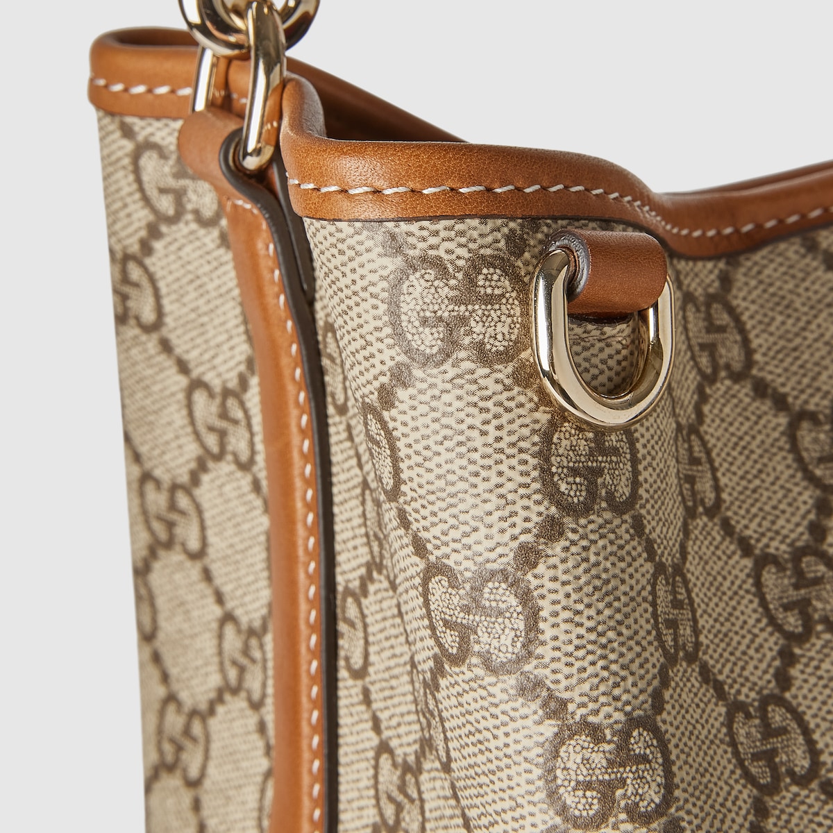 GG Emblem small bucket bag in beige and brown GG fabric | GUCCI® US