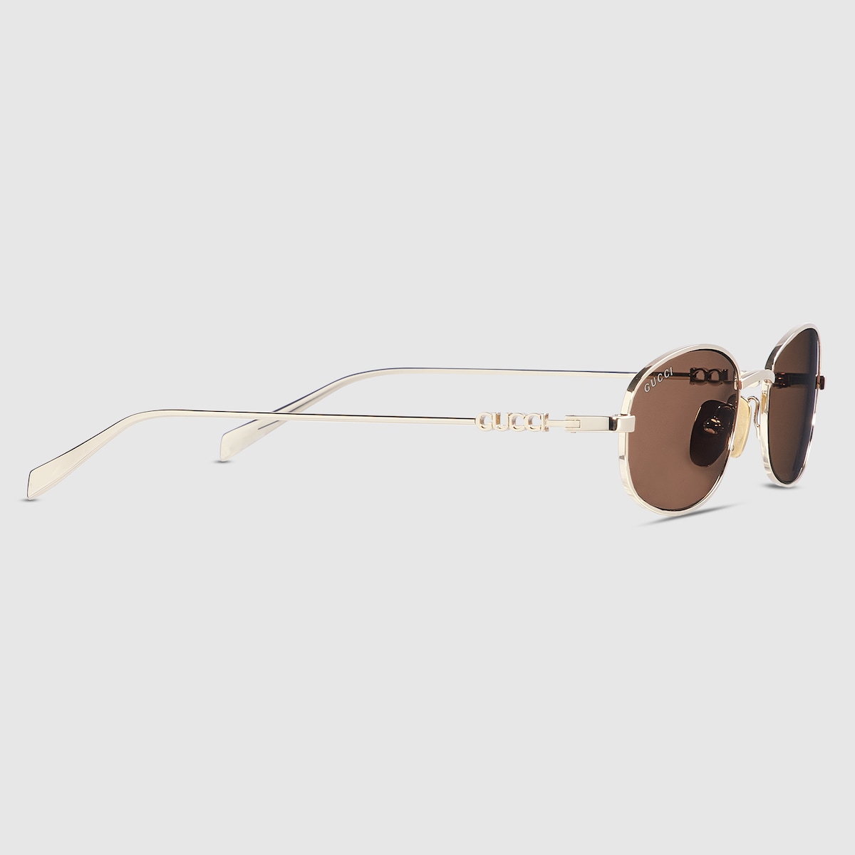 Oval frame sunglasses in light gold | GUCCI® US