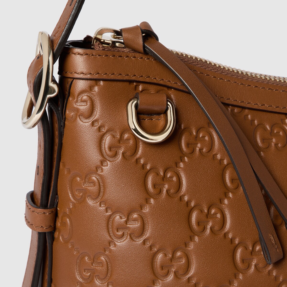 GG Emblem medium shoulder bag in brown GG leather | GUCCI® UK