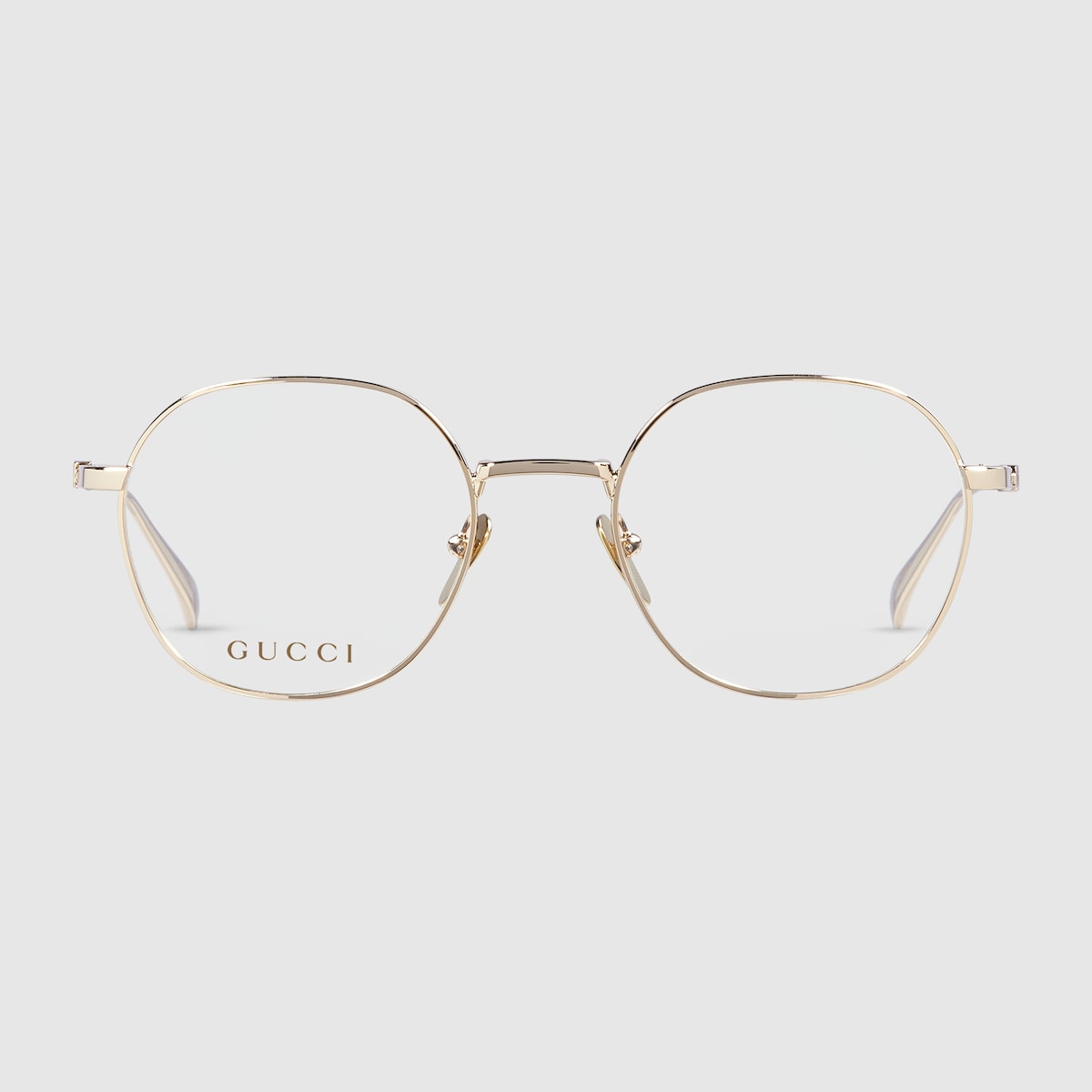 Round optical frame in light gold | GUCCI® UK