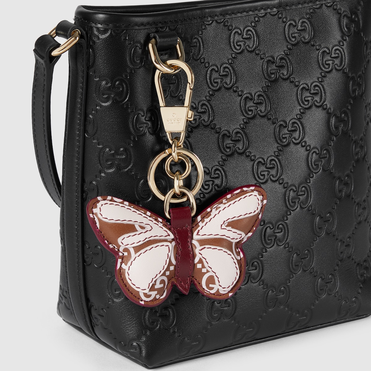 GG Emblem nano bucket bag in black GG leather | GUCCI® US