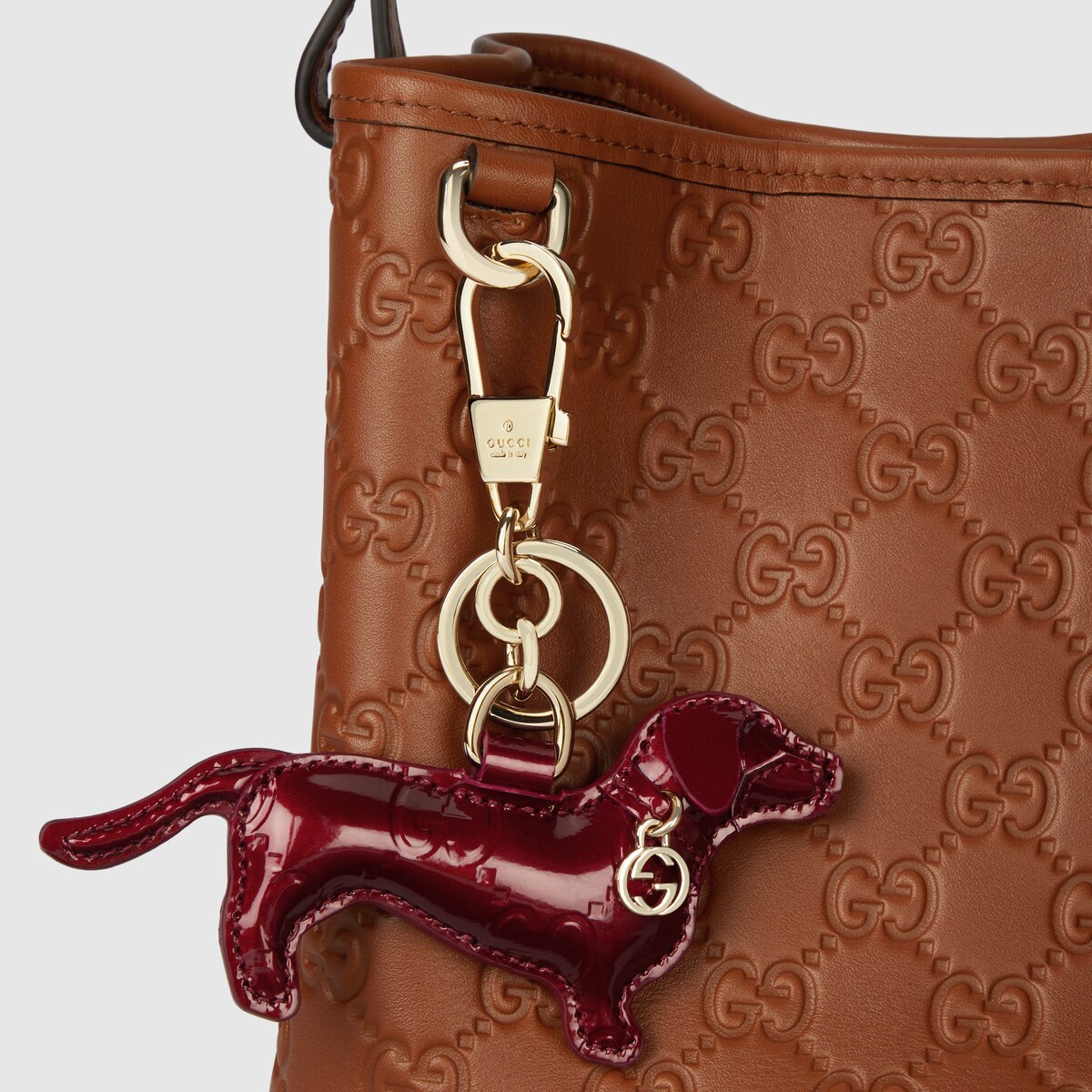 Dog-shaped bag charm in Rosso Ancora patent GG leather | GUCCI® US