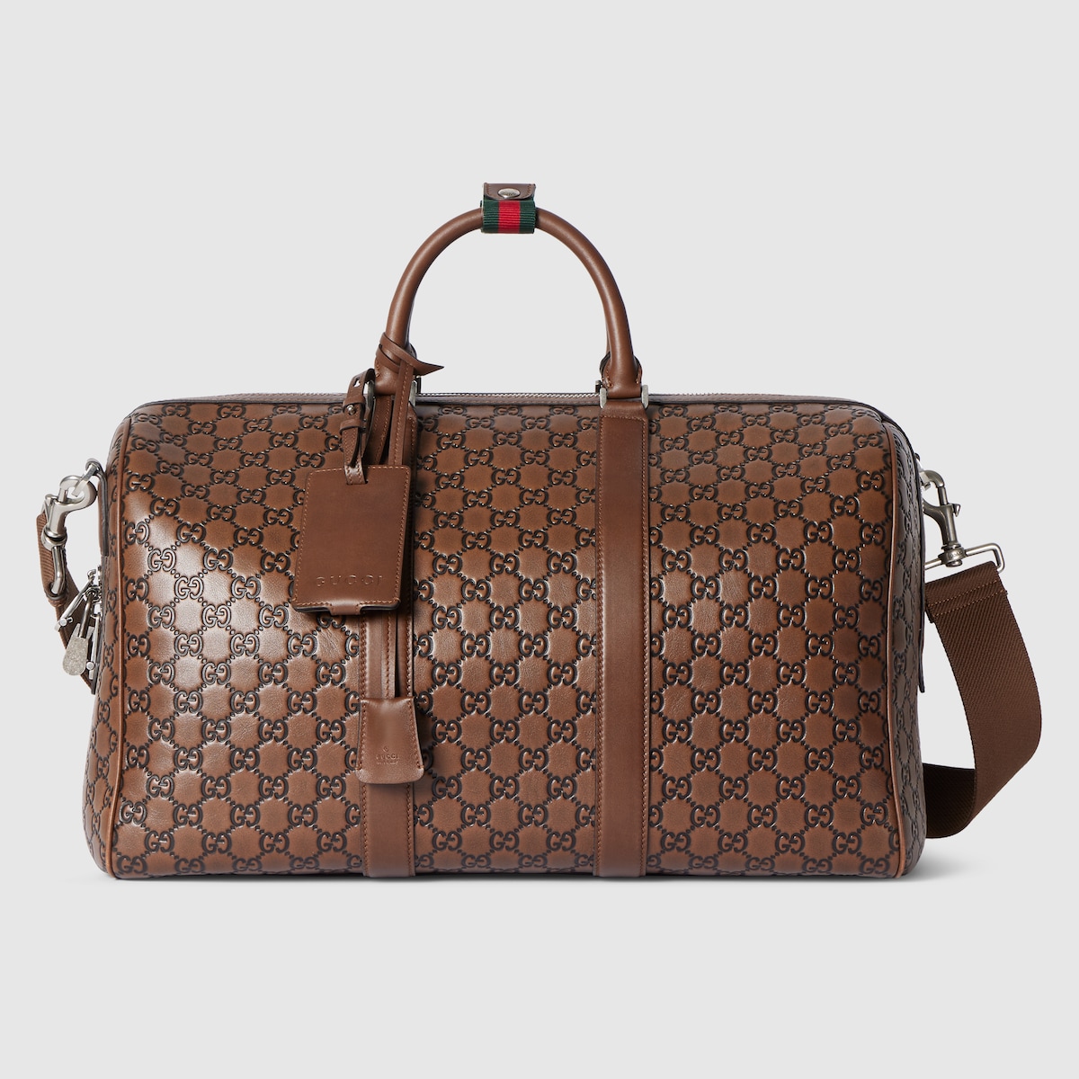 GG Emblem medium duffle bag in brown and black GG leather | GUCCI® CH