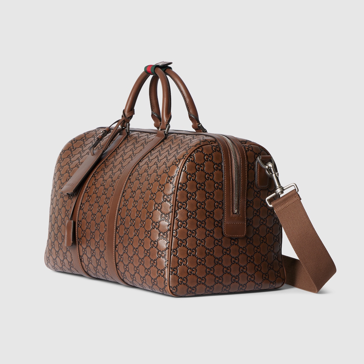 GG Emblem medium duffle bag in brown and black GG leather | GUCCI® CH