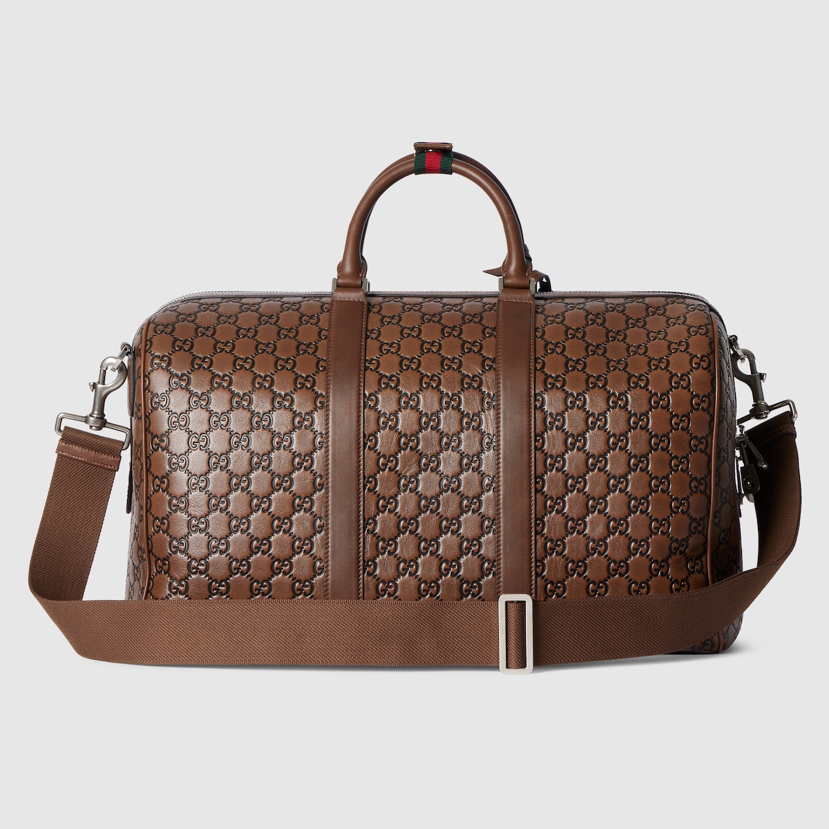 GG Emblem medium duffle bag in brown and black GG leather | GUCCI® CH
