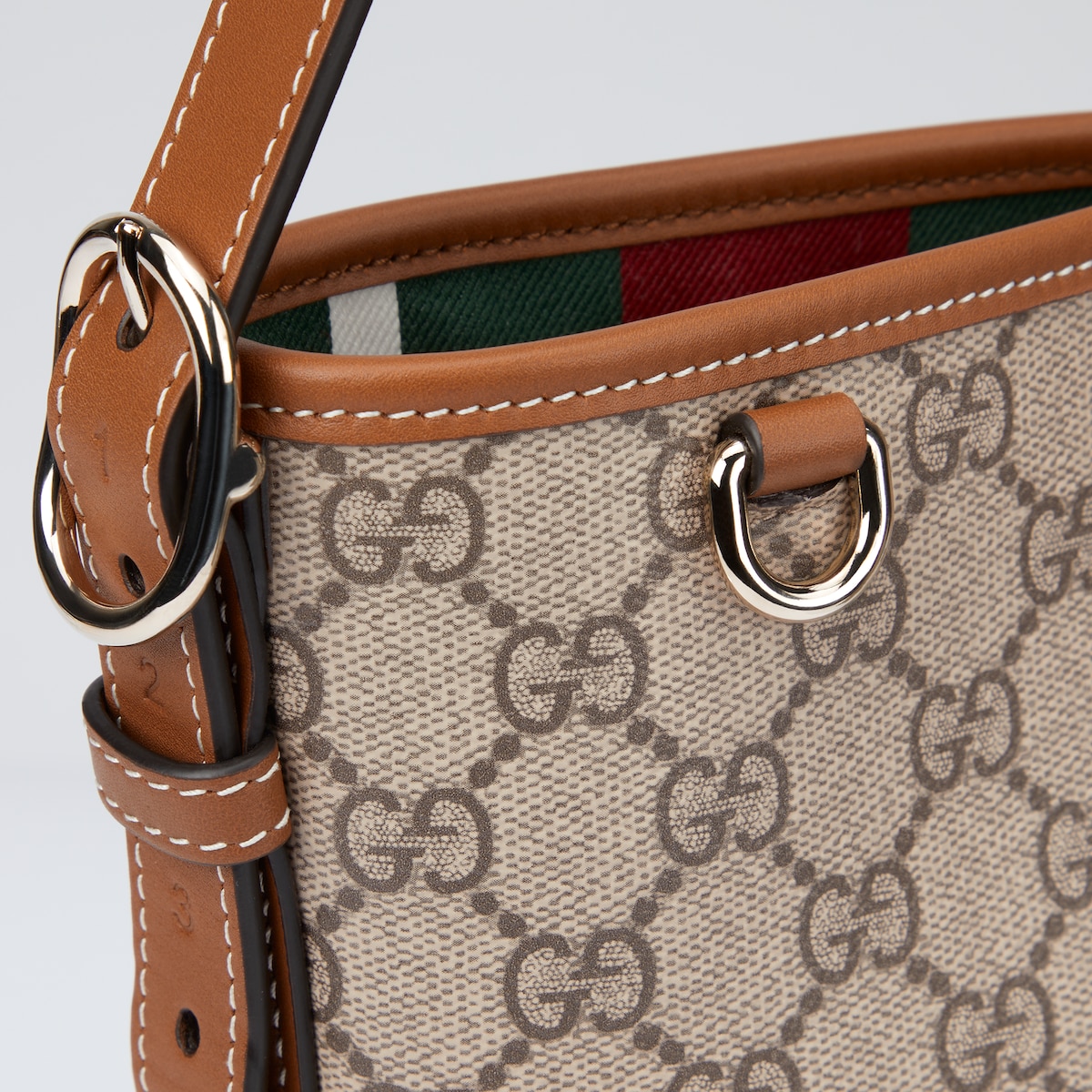 GG Emblem small shoulder bag in beige and brown GG fabric | GUCCI® US
