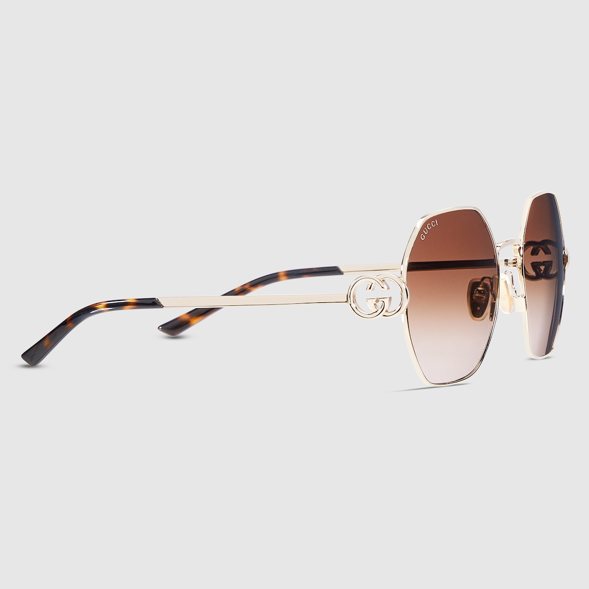 Oval frame sunglasses in gold | GUCCI® SG