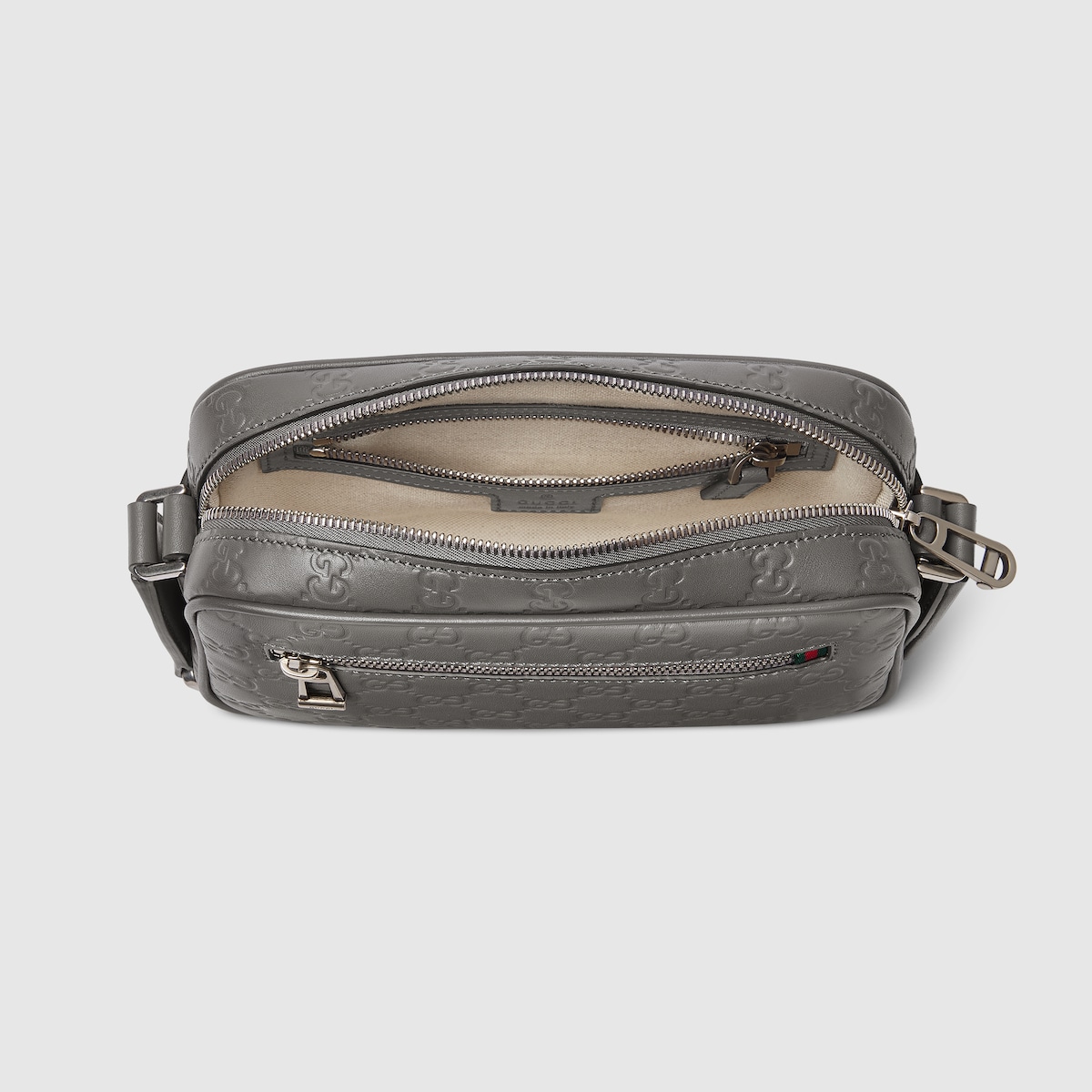 GG Emblem small crossbody bag in grey GG leather | GUCCI® US