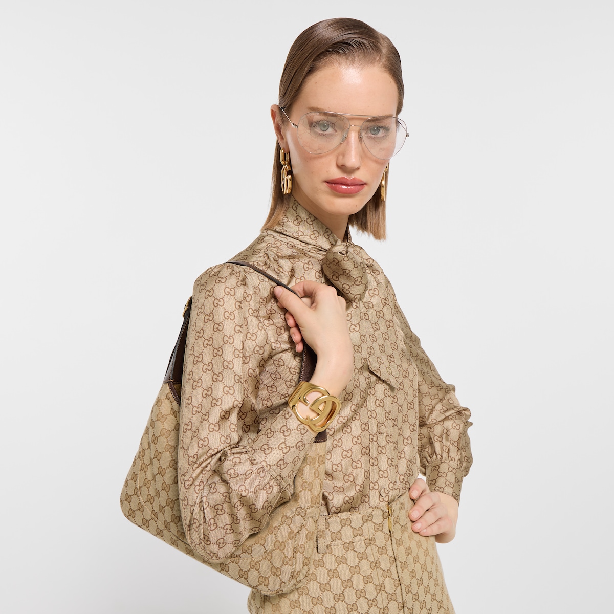 GG Marmont cuff bracelet in gold-toned brass | GUCCI® US