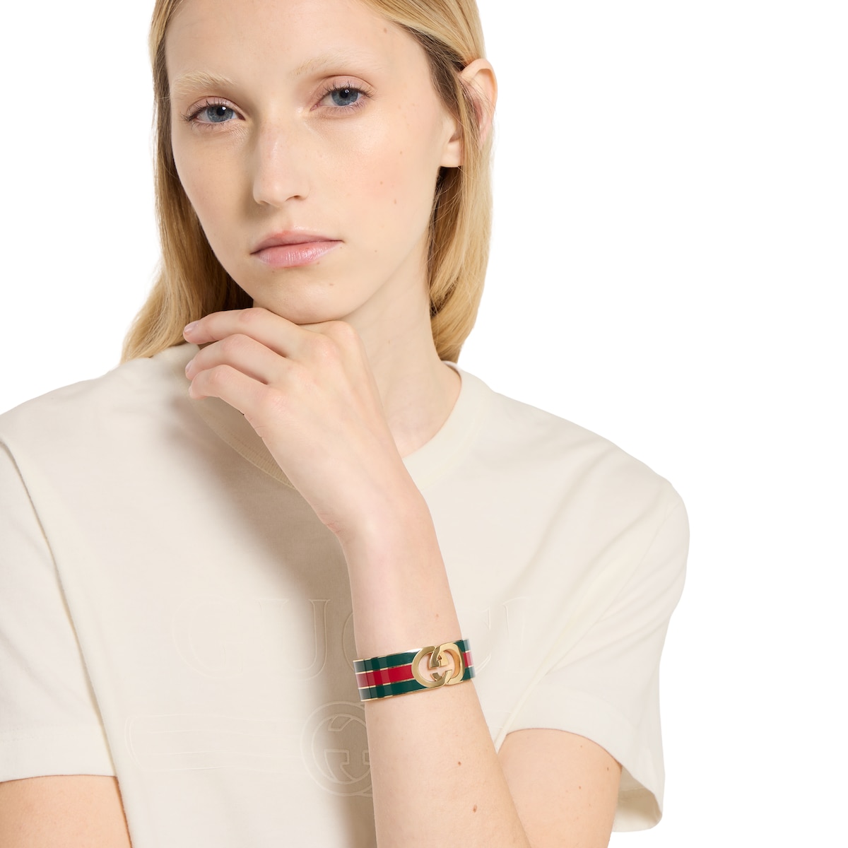 Gucci Interlocking bangle bracelet in gold-toned brass | GUCCI® US