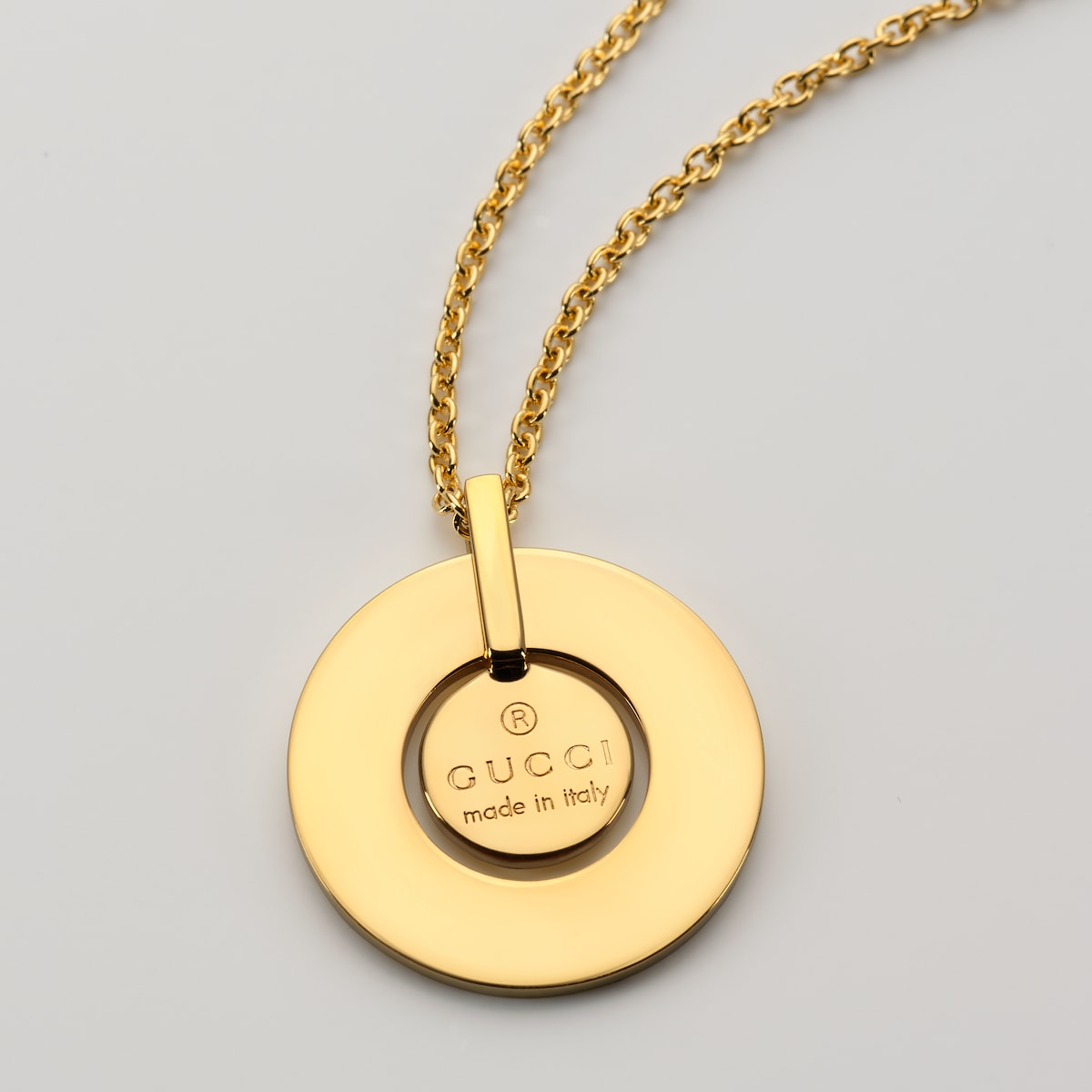 Gucci Trademark pendant necklace in gold-toned brass | GUCCI® UK