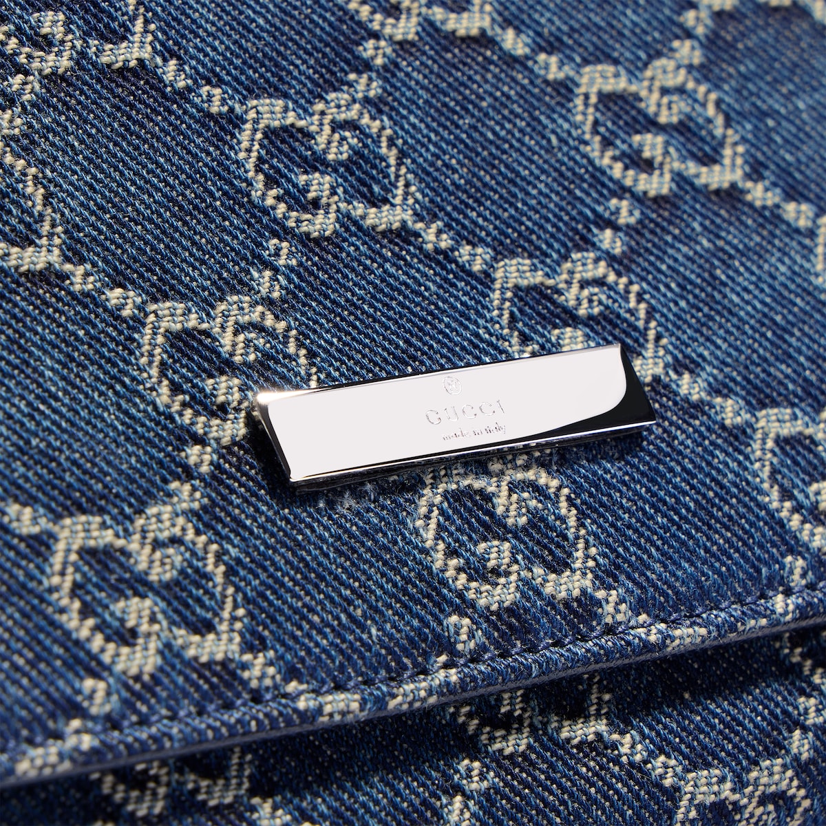 Small pouch with strap and Gucci plaque in dark blue GG denim | GUCCI® SG