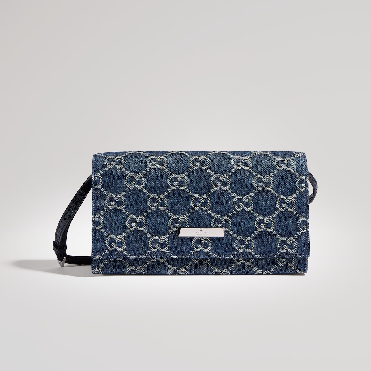 Small pouch with strap and Gucci plaque in dark blue GG denim | GUCCI® SG