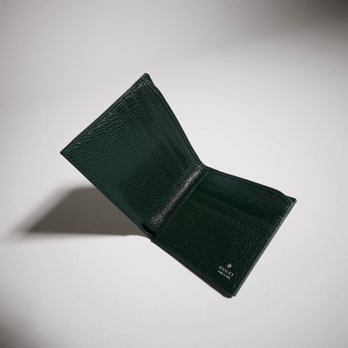 Gucci Essence Classic bi-fold wallet in dark green GG canvas | GUCCI® UK