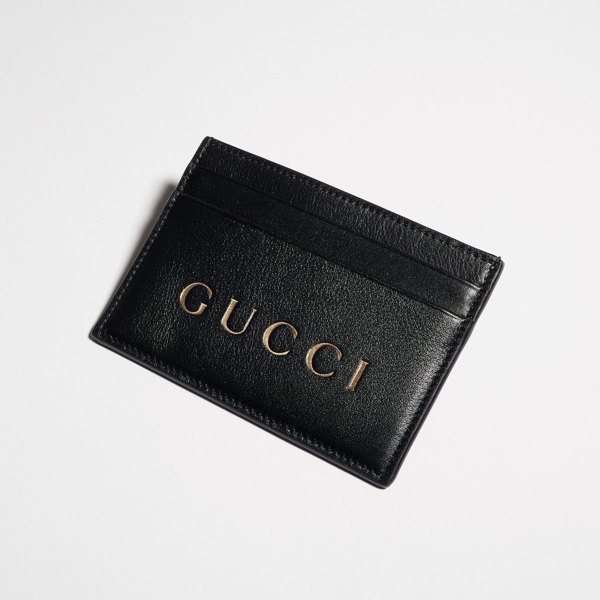 Card case with gold-foiled logo in black leather | GUCCI® CA