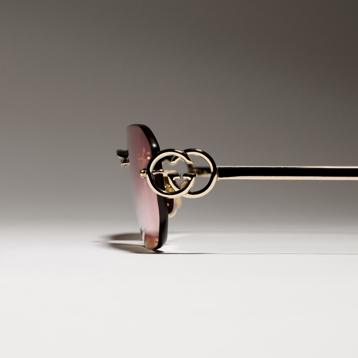 Rectangular-frame sunglasses in gold metal | GUCCI® NZ