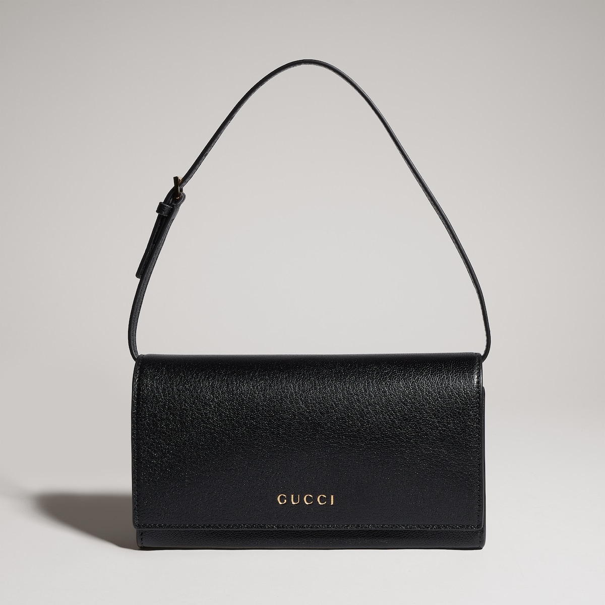 Mini pouch with Gucci lettering in black leather | GUCCI® US