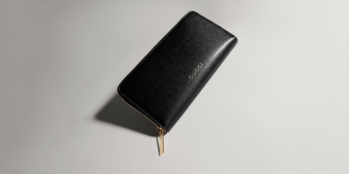 Zip around wallet with Gucci lettering in black leather | GUCCI® US