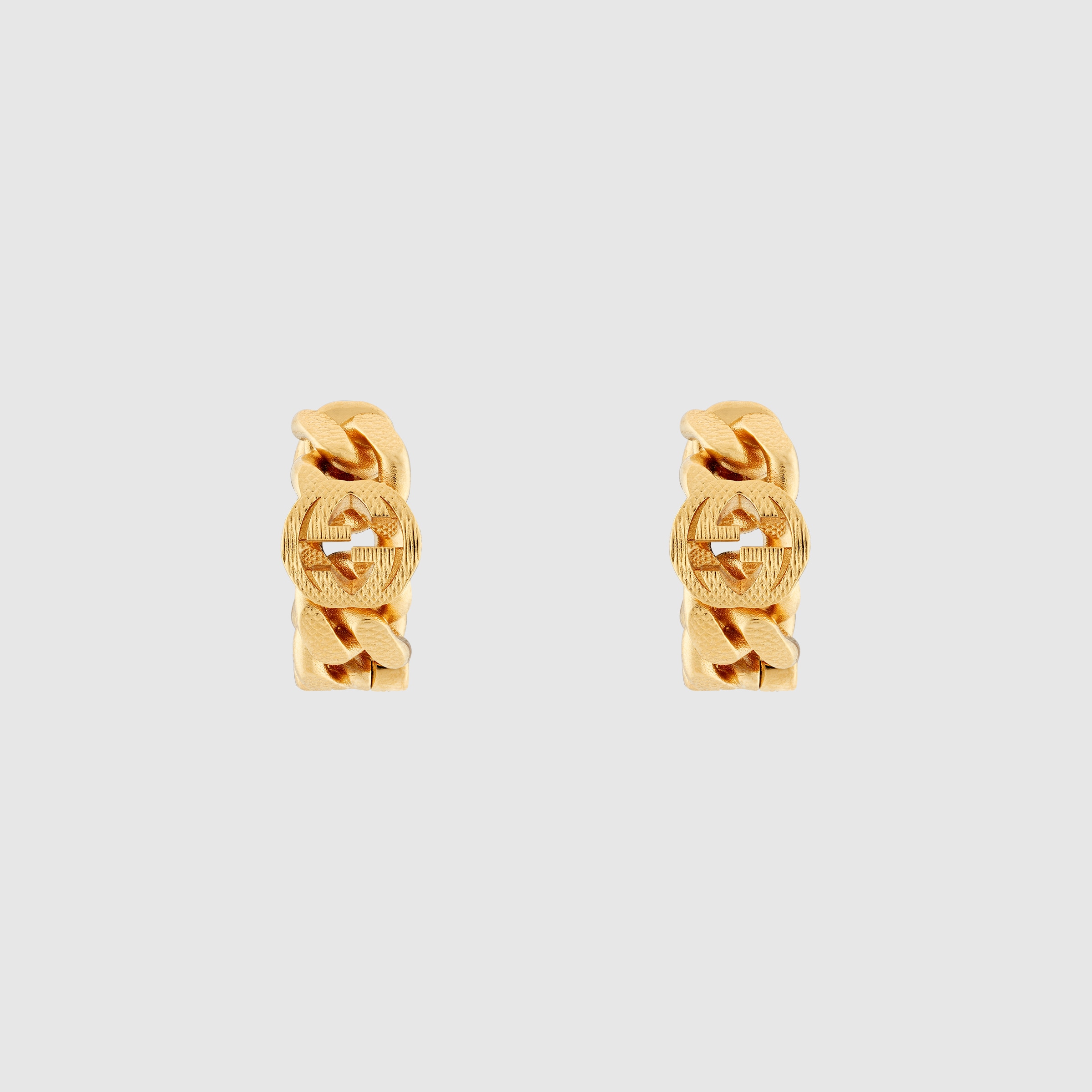 Gucci Interlocking hoop earrings in yellow gold-toned metal | GUCCI® US
