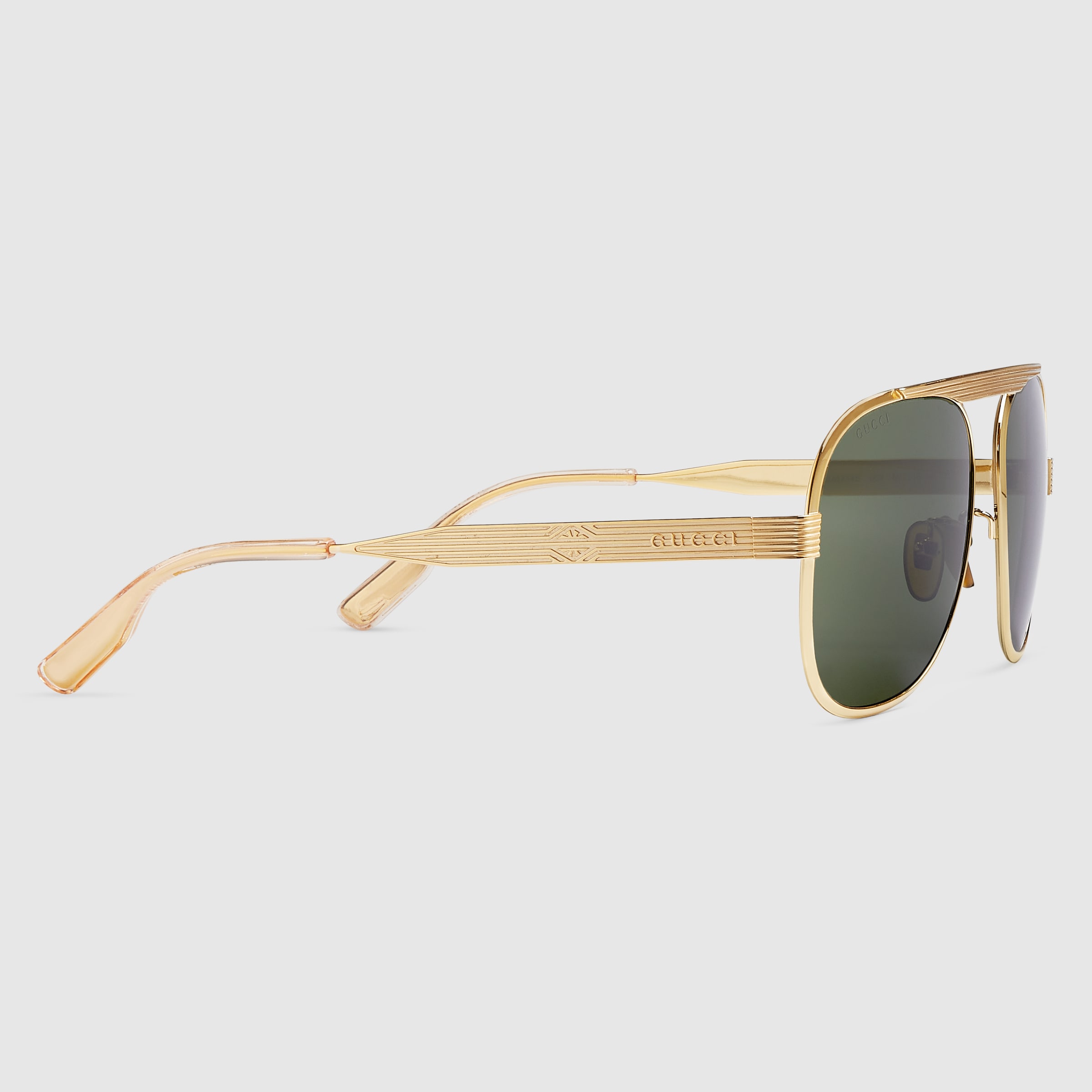 Navigator frame sunglasses in gold-toned metal | GUCCI® SG