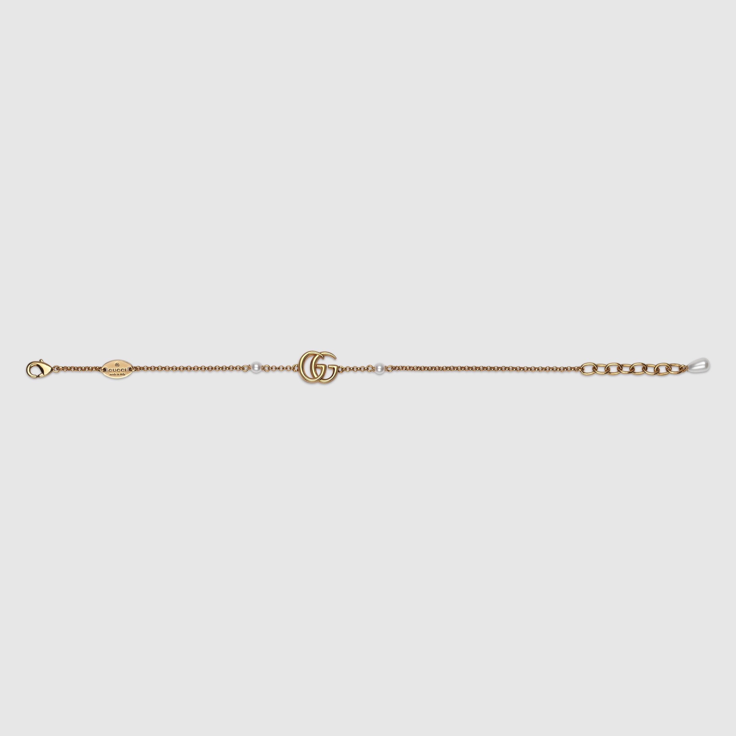 GG Marmont chain bracelet with charm in yellow gold-toned metal | GUCCI ...