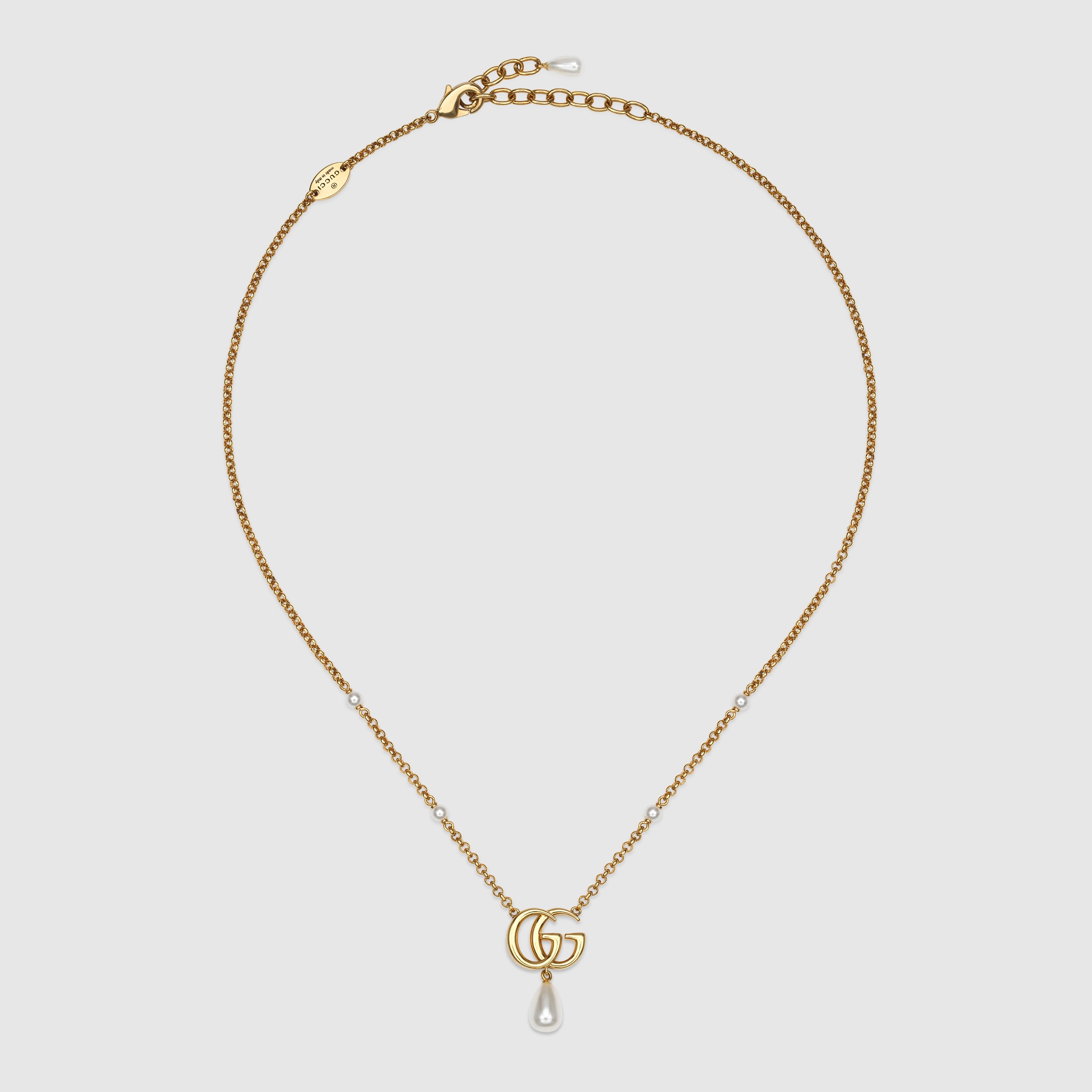 GG Marmont pendant necklace in yellow gold-toned metal | GUCCI® US