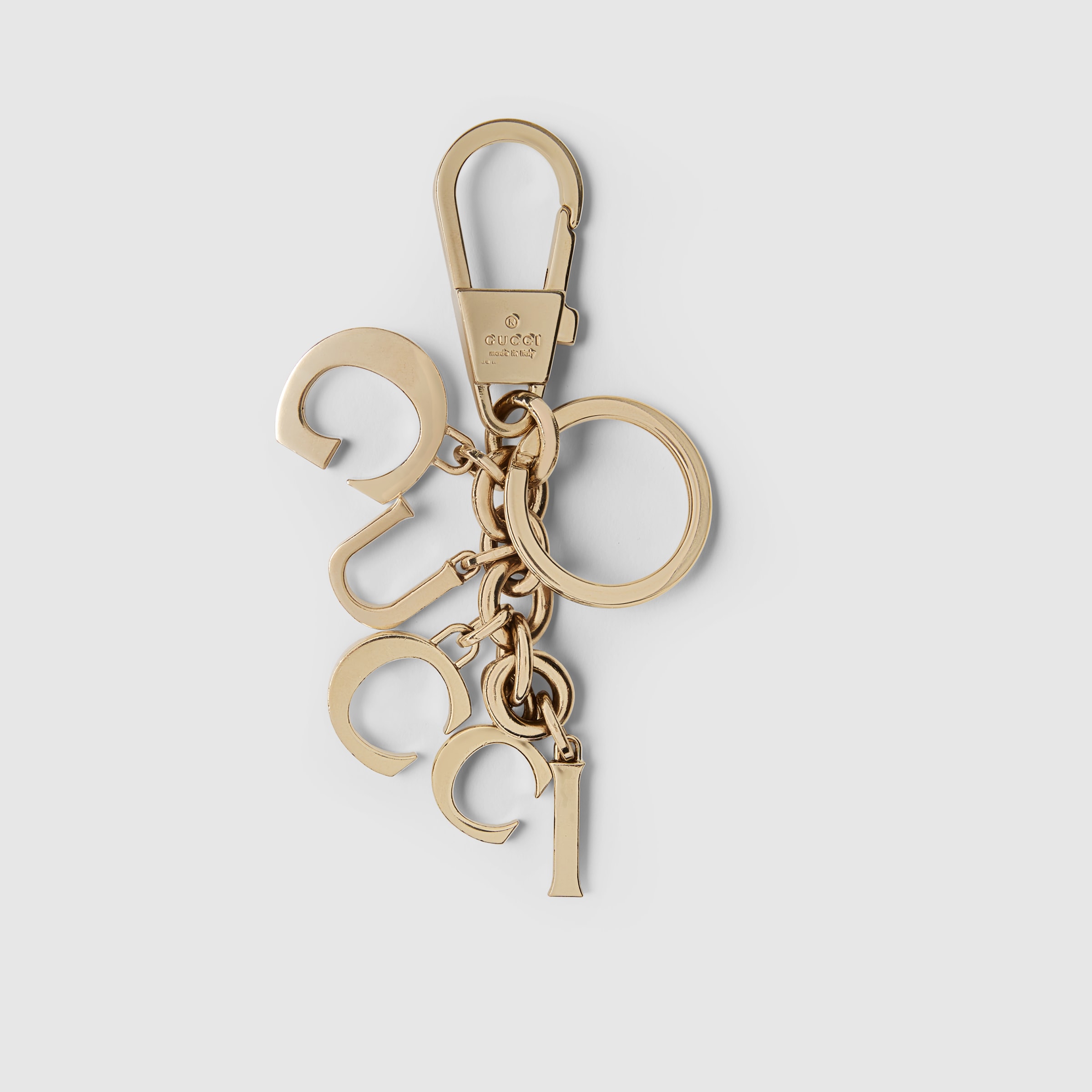 Gucci script keychain in light gold-toned metal | GUCCI® Canada