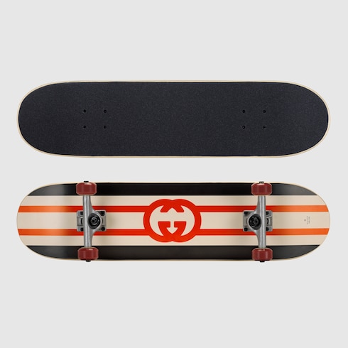 Interlocking G stripe skateboard in red and white | GUCCI® SE
