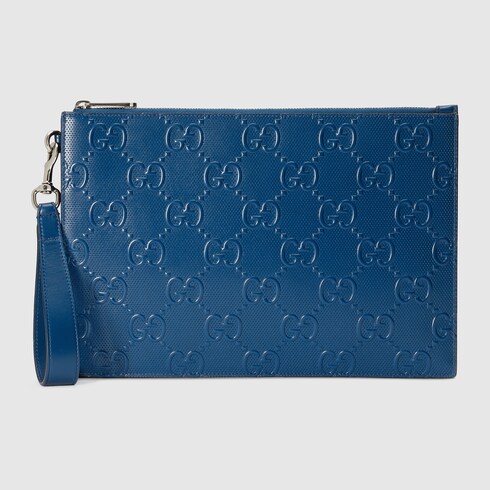 GG embossed pouch in blue leather | GUCCI® IE